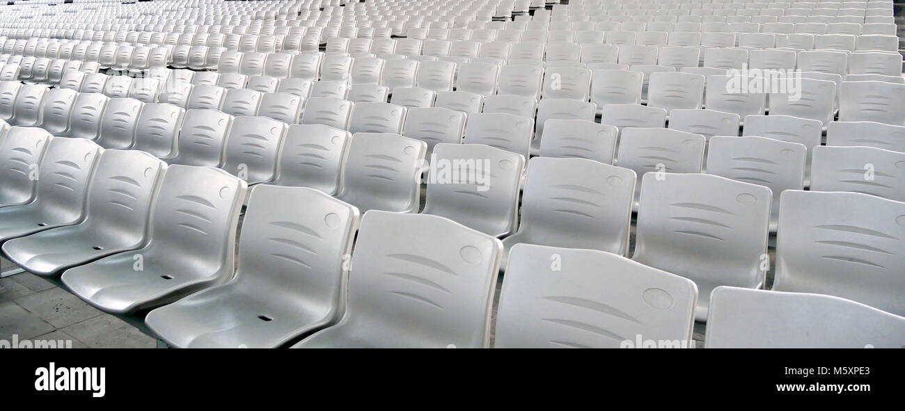 Row of white stadium seats.Empty sports venue Stock Photo - Alamy