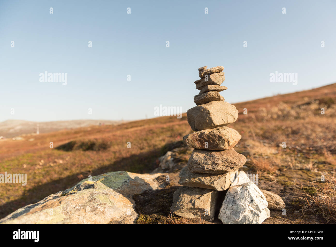 Tall stack of natural irregular stones balanced on top of one another ...
