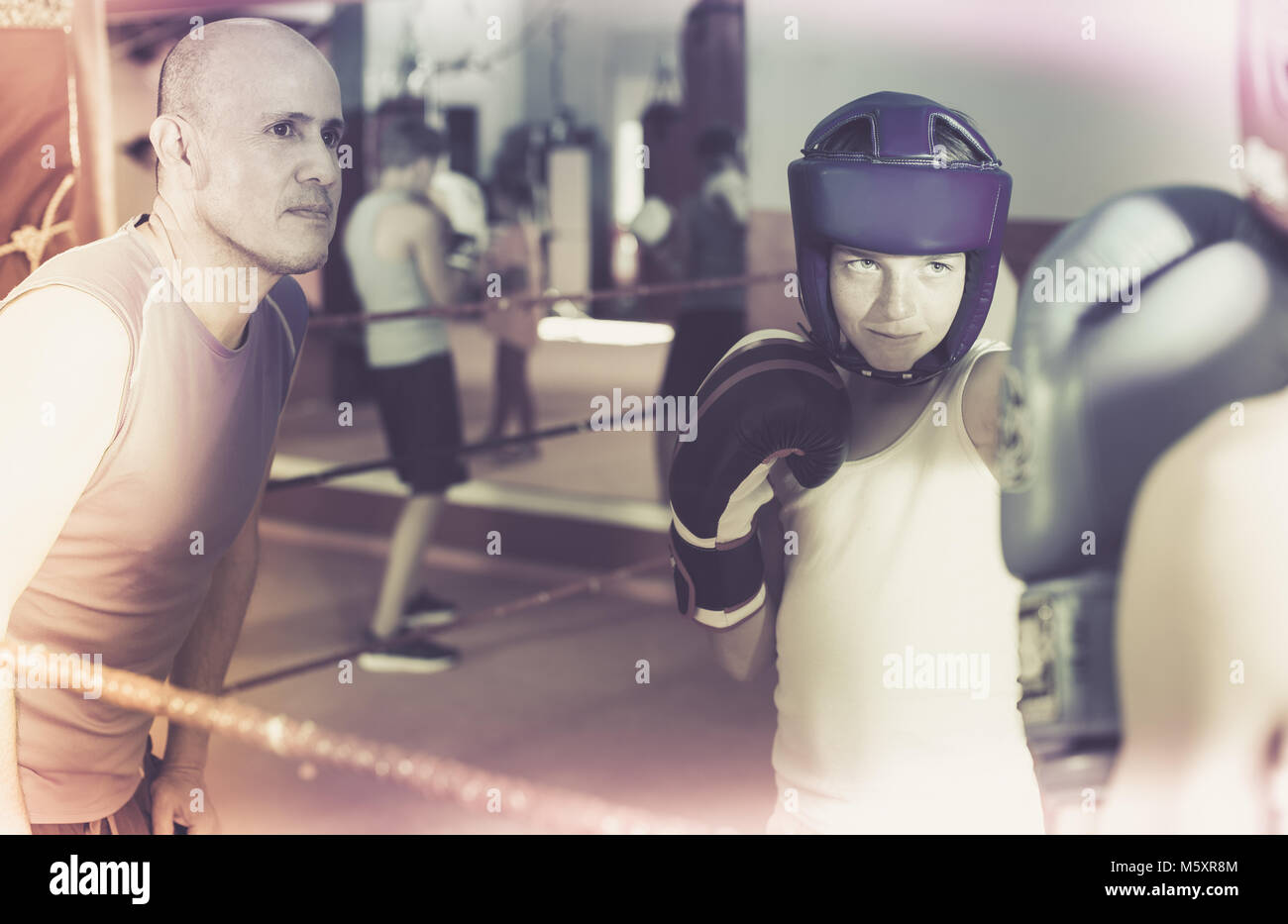Group of children training with trainer on boxing ring at gym Stock ...