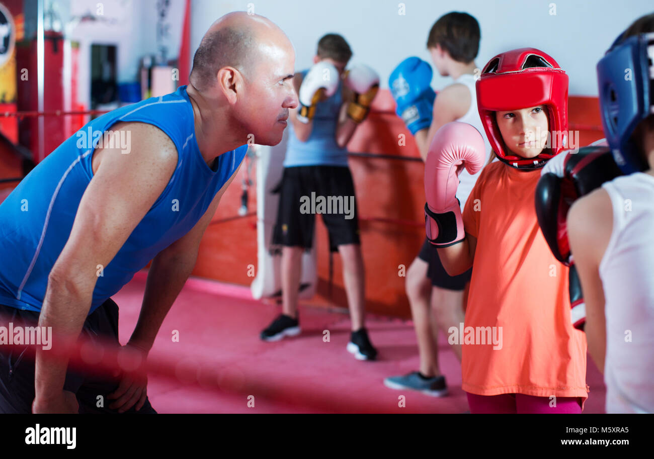 Teenage boxer sparring on the ring in boxing hall Stock Photo - Alamy