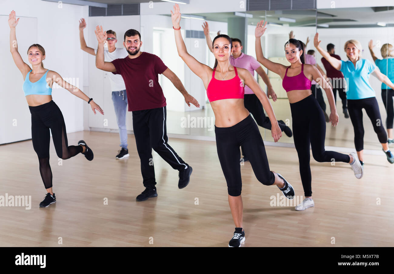 Smiling people dancing aerobics at lesson in the dance class Stock ...