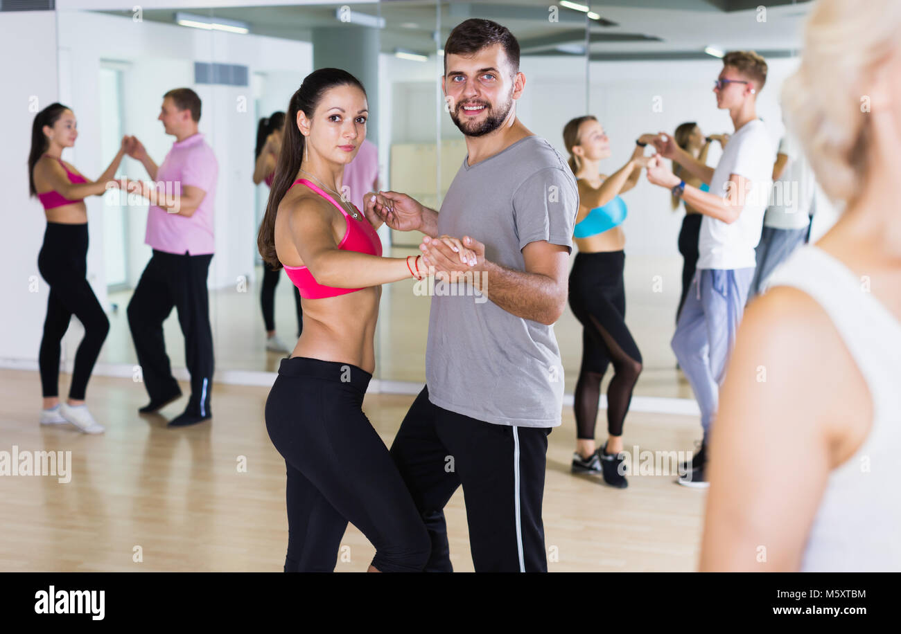 Positive dancing pair dance together in studio Stock Photo - Alamy