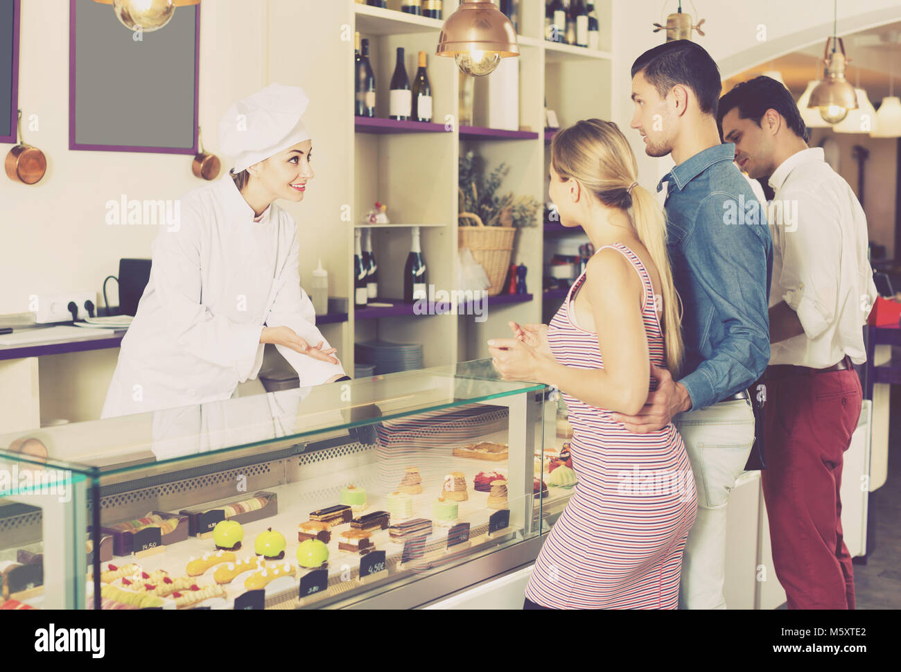 Confectioner serving client hi-res stock photography and images - Alamy