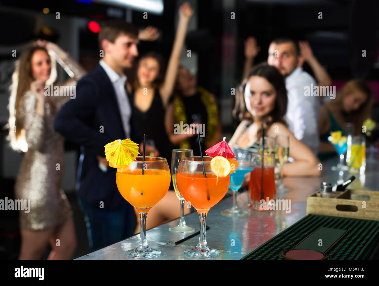 Cocktails are on the bar for office workers during corporate events ...