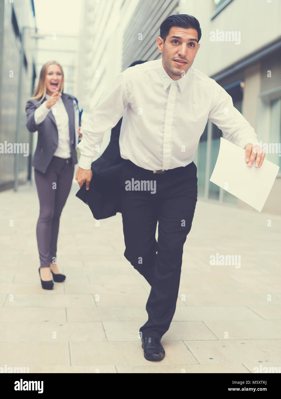 Adult employee is running away with documants from his female boss ...