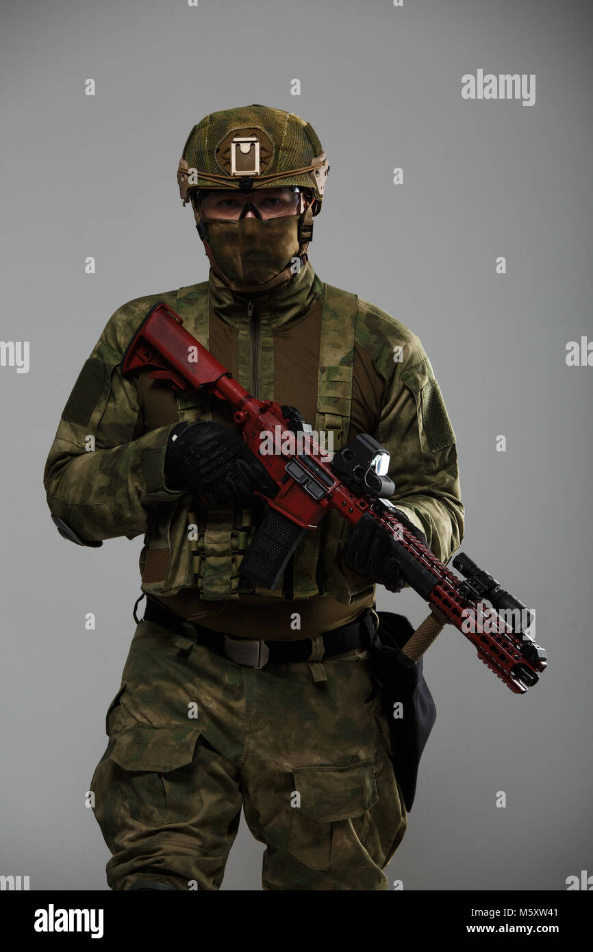 Photo of military man in helmet with gun Stock Photo - Alamy