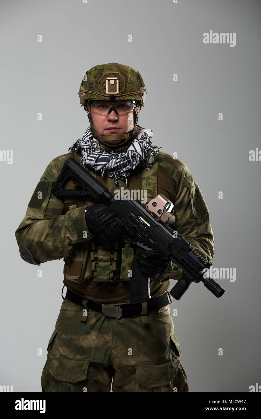 Photo of soldier with gun in his hand Stock Photo - Alamy