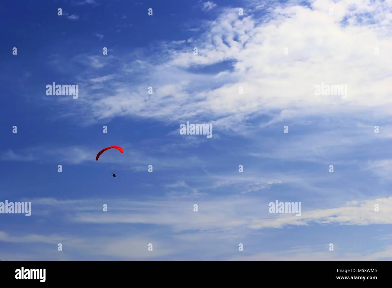 nice red parachute in the sky Stock Photo - Alamy