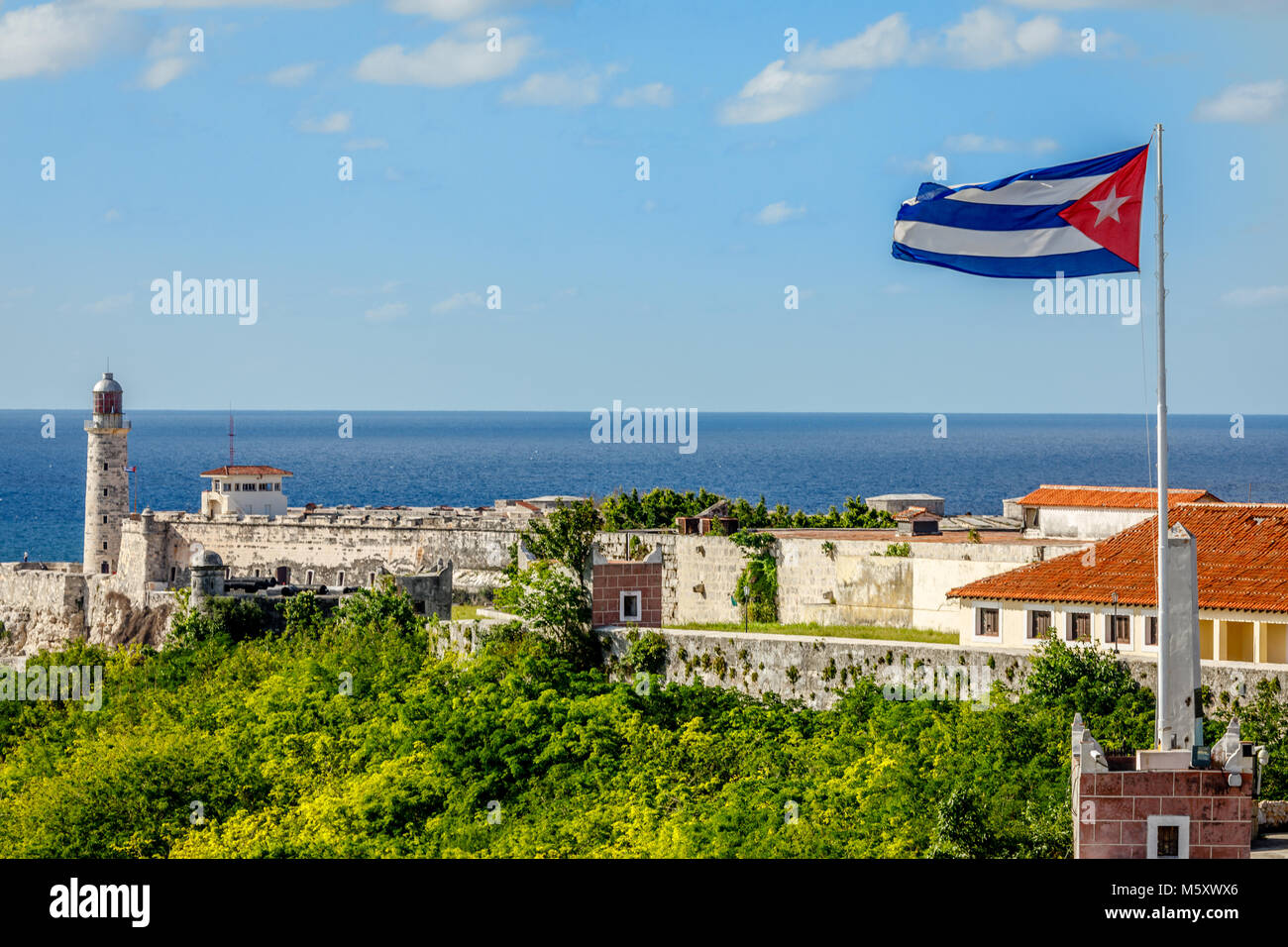 El Morro spanish fortress with lighthouse, cannons and cuban flag in th ...