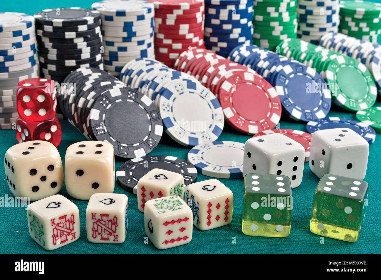 dice and tokens on green carpet Stock Photo - Alamy