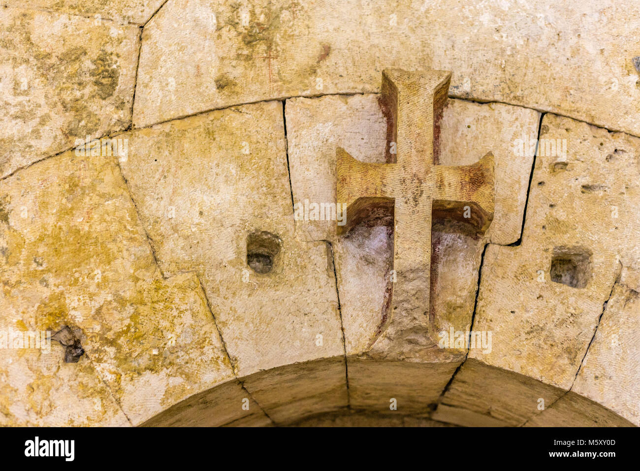 stone cross on arch of ancient wall Stock Photo - Alamy
