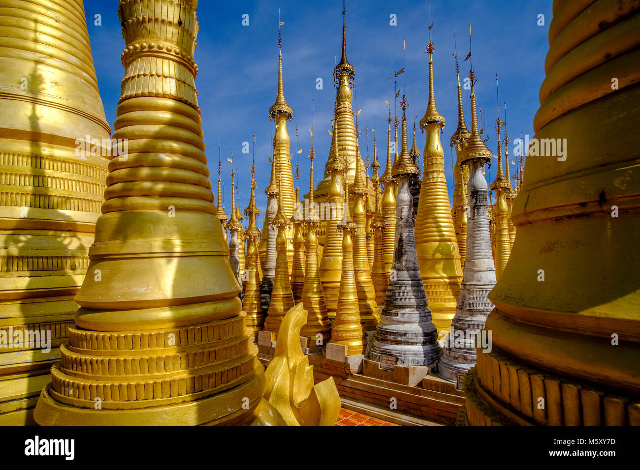 The partly restored monuments of Shwe Indein Pagoda are located on a ...