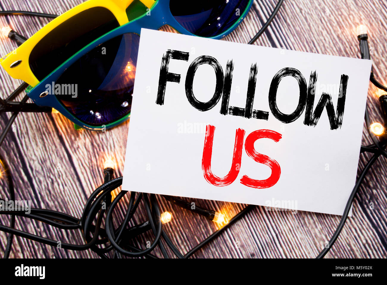 Writing text showing Follow Us. Business concept for Social Media ...