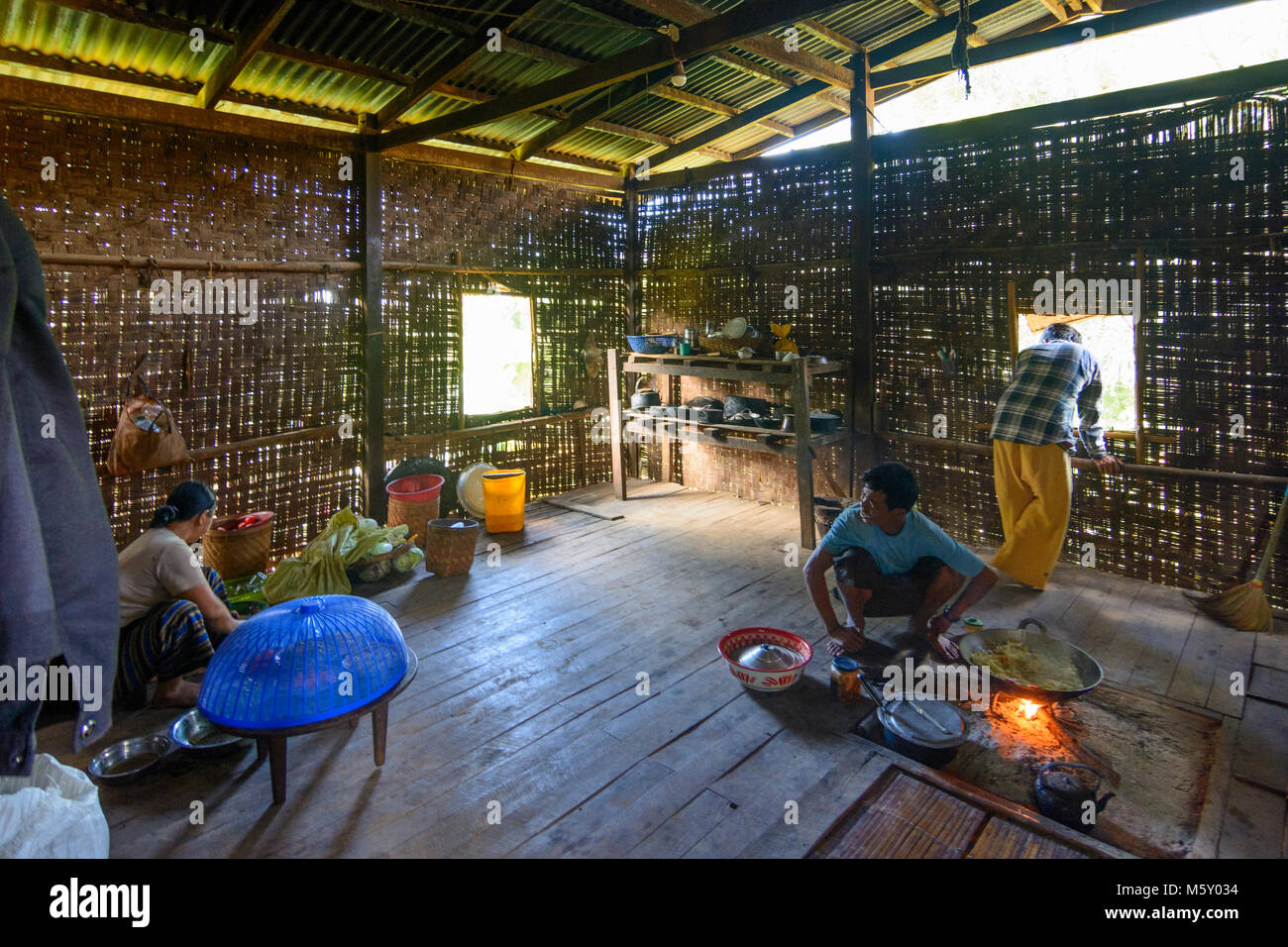 Kalaw: family cooking in kitchen traditional bamboo stilt house, Danu ...