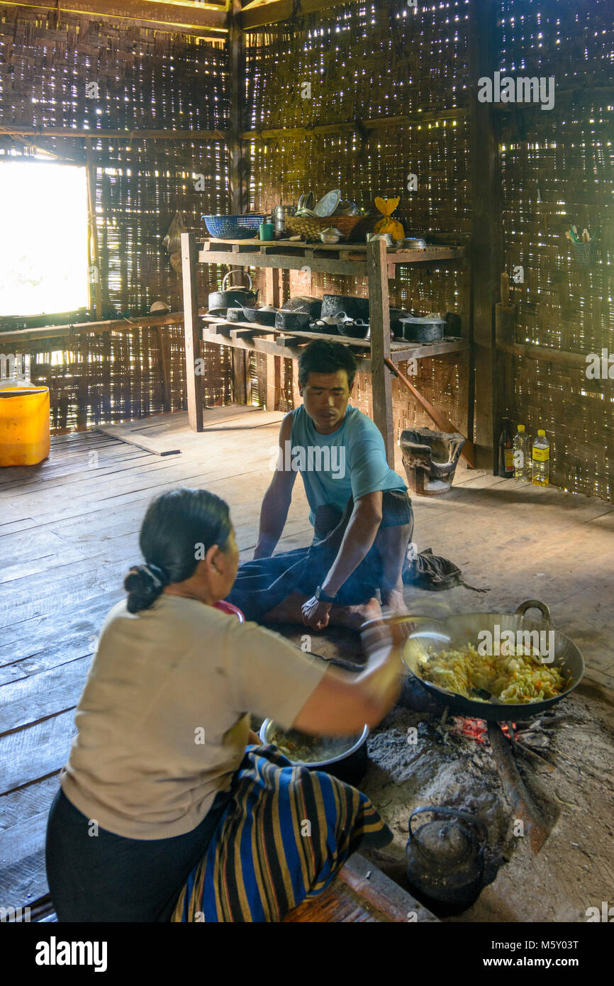 Kalaw: family cooking in kitchen traditional bamboo stilt house, Danu ...