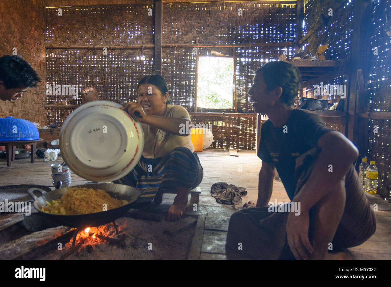 Kalaw: family cooking in kitchen traditional bamboo stilt house, Danu ...