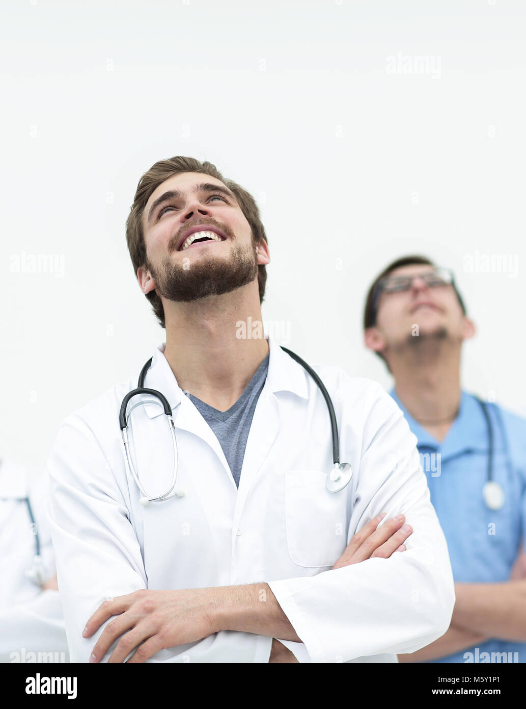 talented doctor looking at the top, on the copy space Stock Photo - Alamy