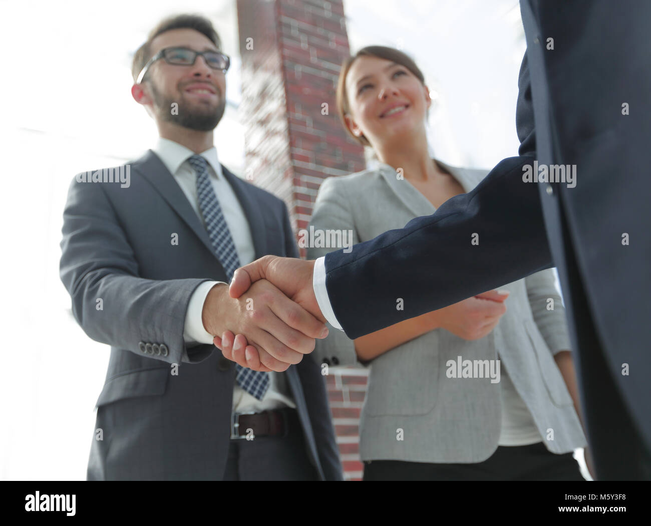 friendly handshake of business people Stock Photo - Alamy
