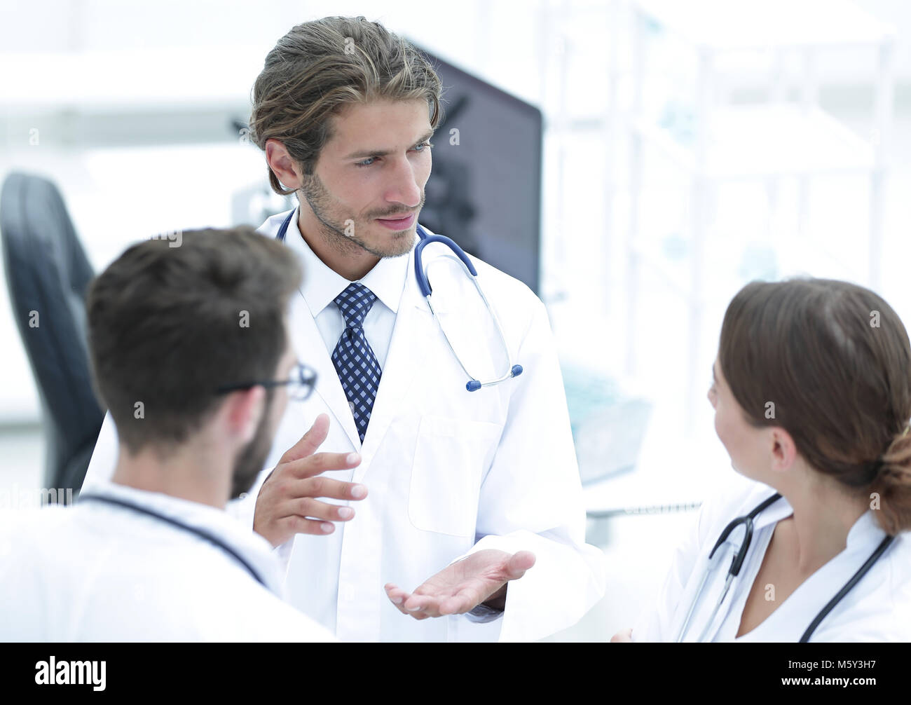 Group of doctors talking Stock Photo - Alamy