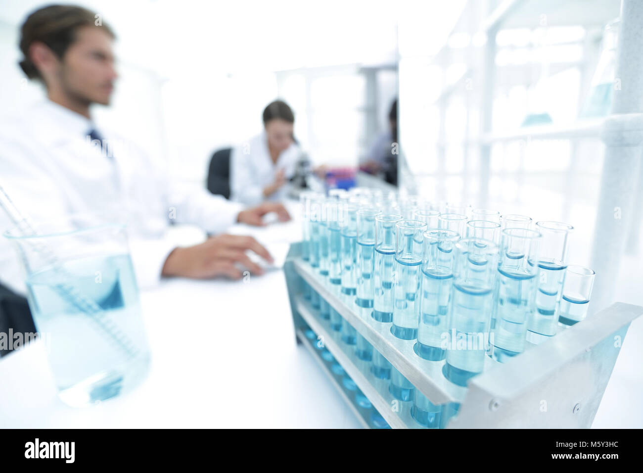 side view of scientists working in laboratory Stock Photo - Alamy