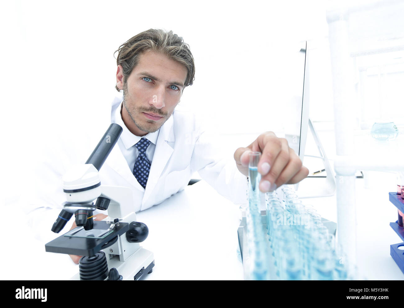 laboratory scientist working in a laboratory with a microscope Stock ...