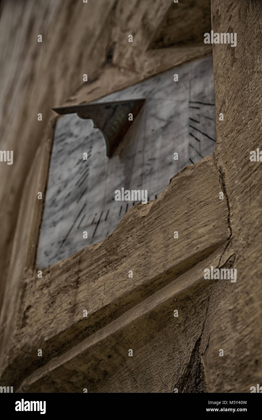 and the gnomon in the antique broken wall Stock Photo - Alamy