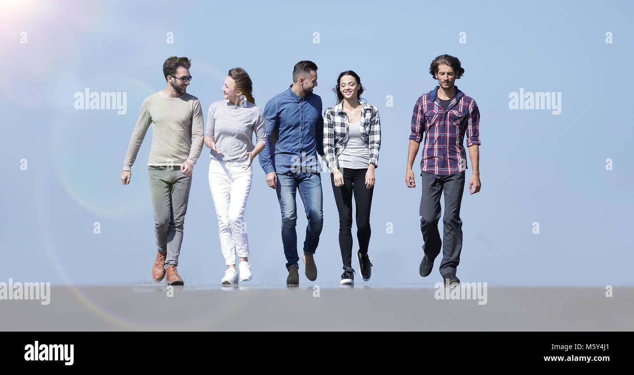 team of young people walking along the road.outdoors Stock Photo - Alamy