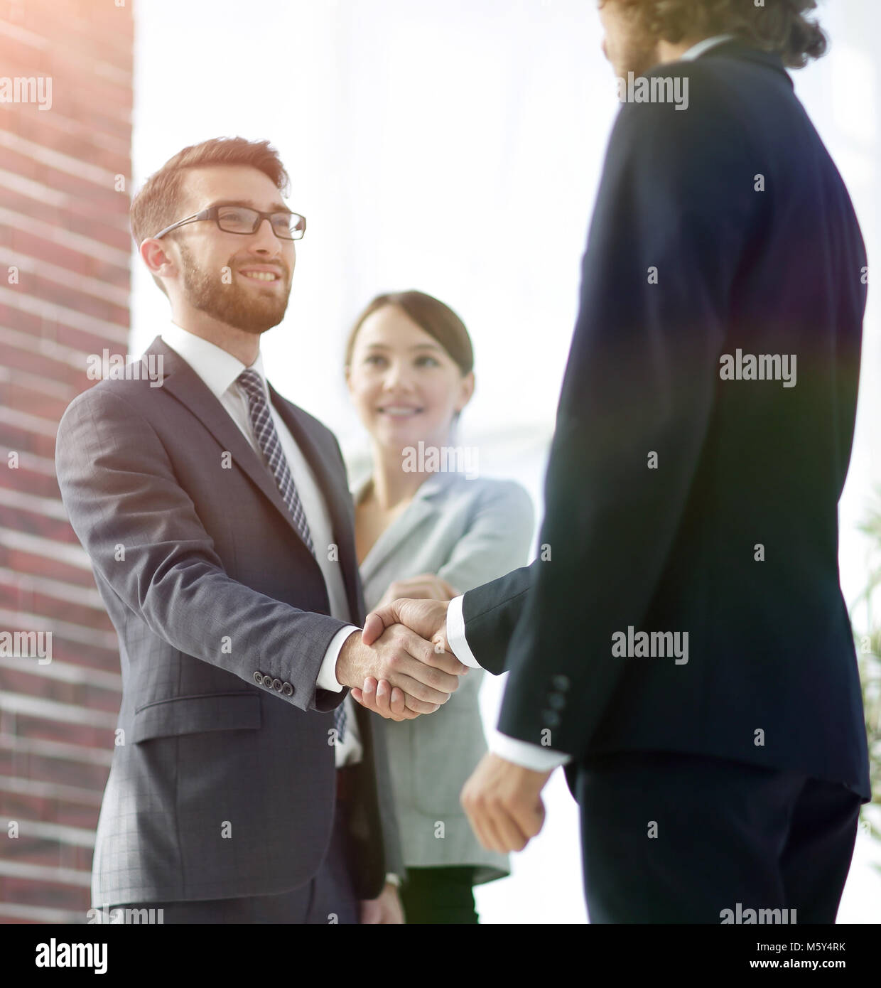 Two Business men shaking hands Stock Photo - Alamy