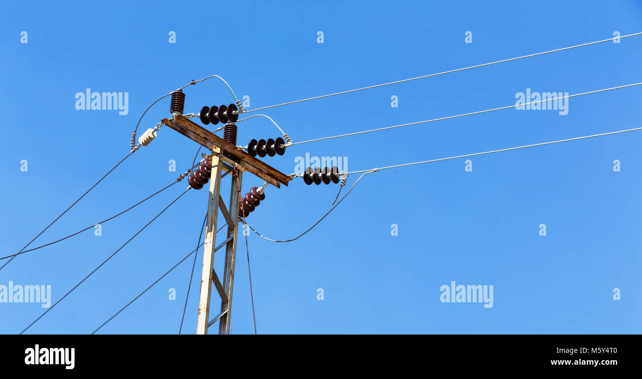 in australia the concept of power line with electrical pole in the clear sky Stock Photo - Alamy