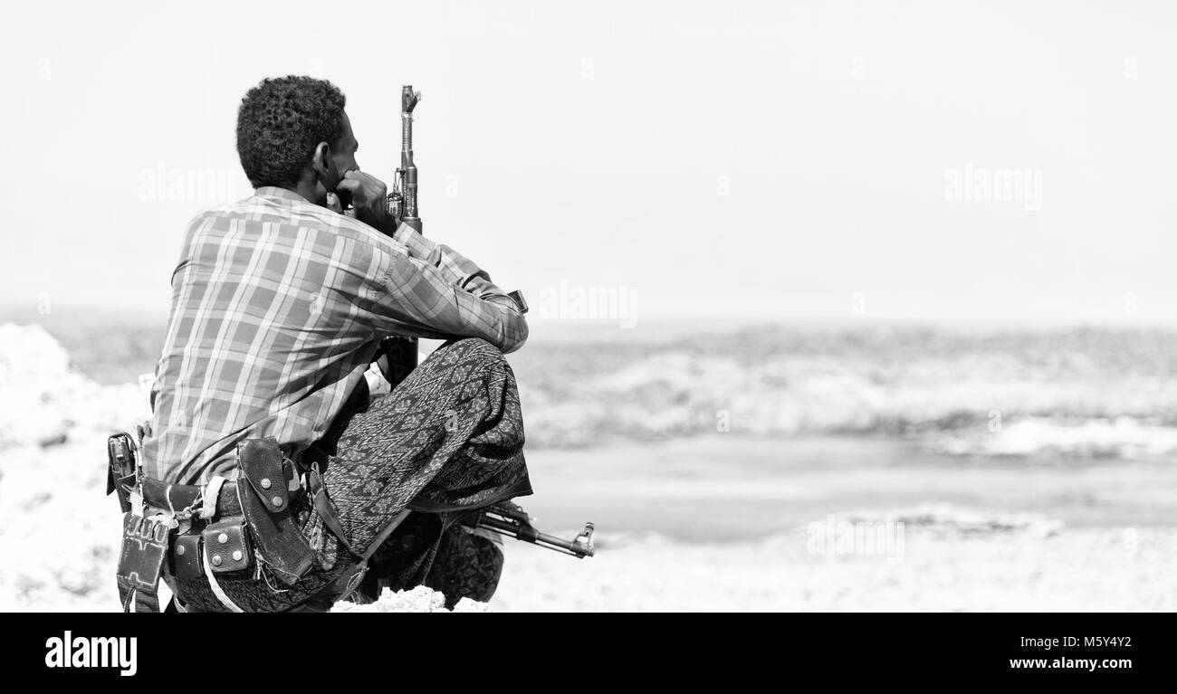 africa in the land of danakil ethiopia a black soldier and his gun ...