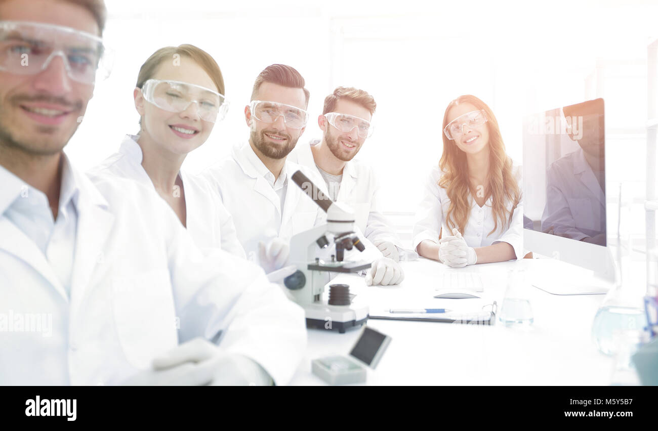 Male scientist and the team in the lab Stock Photo - Alamy