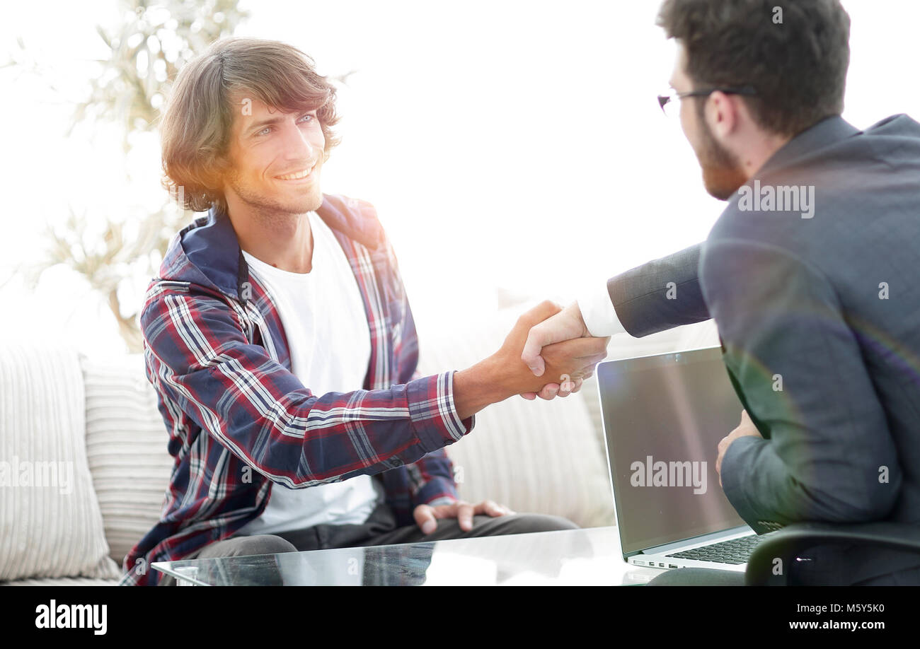 manager shakes hands with his client Stock Photo - Alamy