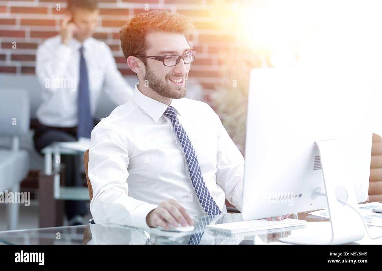Manager works on a computer Stock Photo - Alamy
