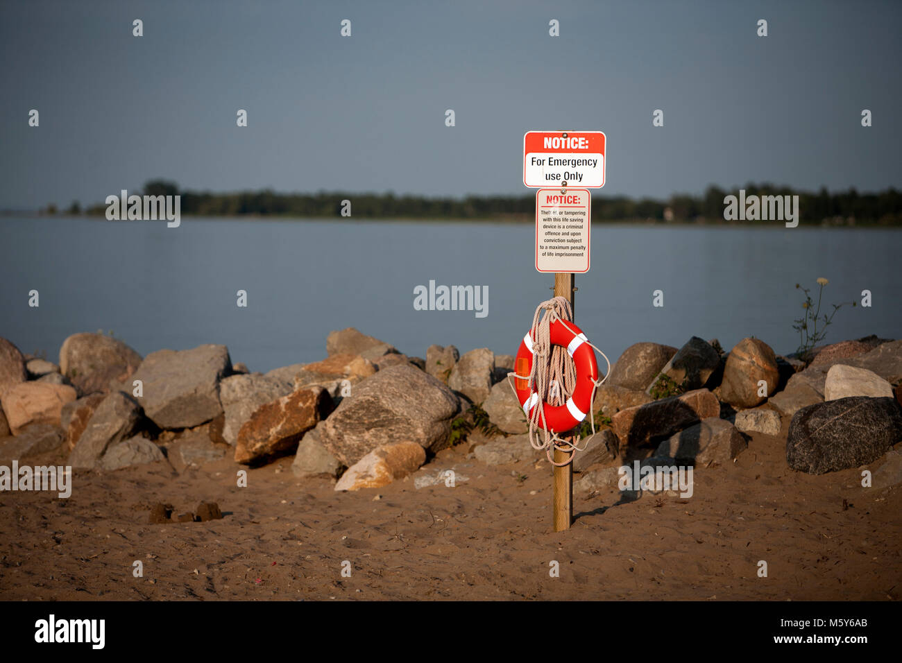 Life Preserver Saver Beach Swim Rocky Shore Stock Photo - Alamy