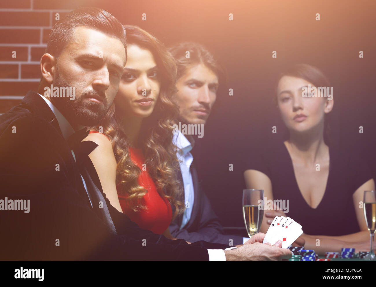 side view of group of people playing poker together in casino Stock ...