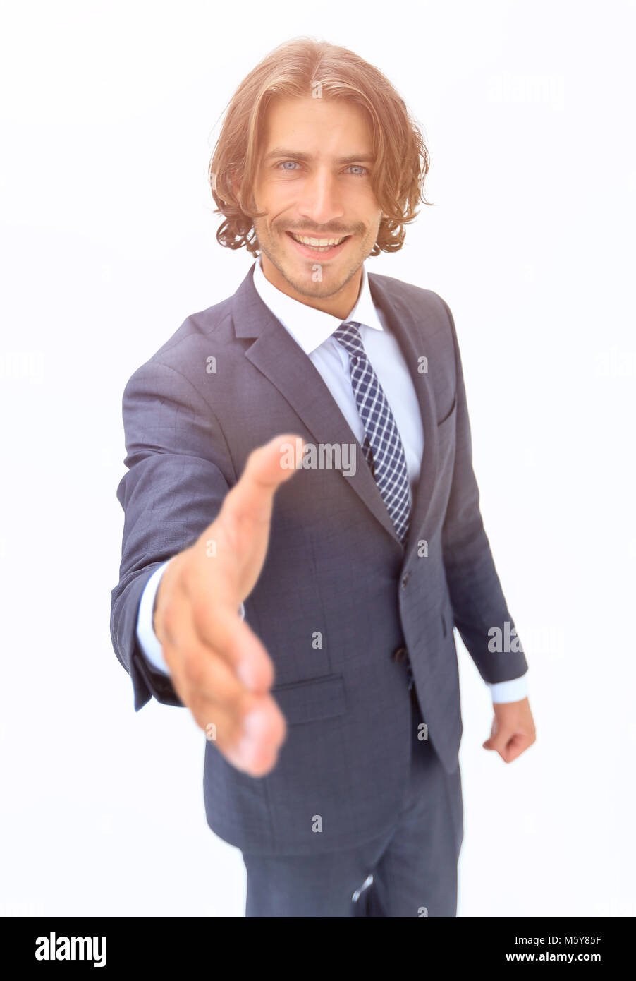 Young Man offering handshake over white background Stock Photo - Alamy