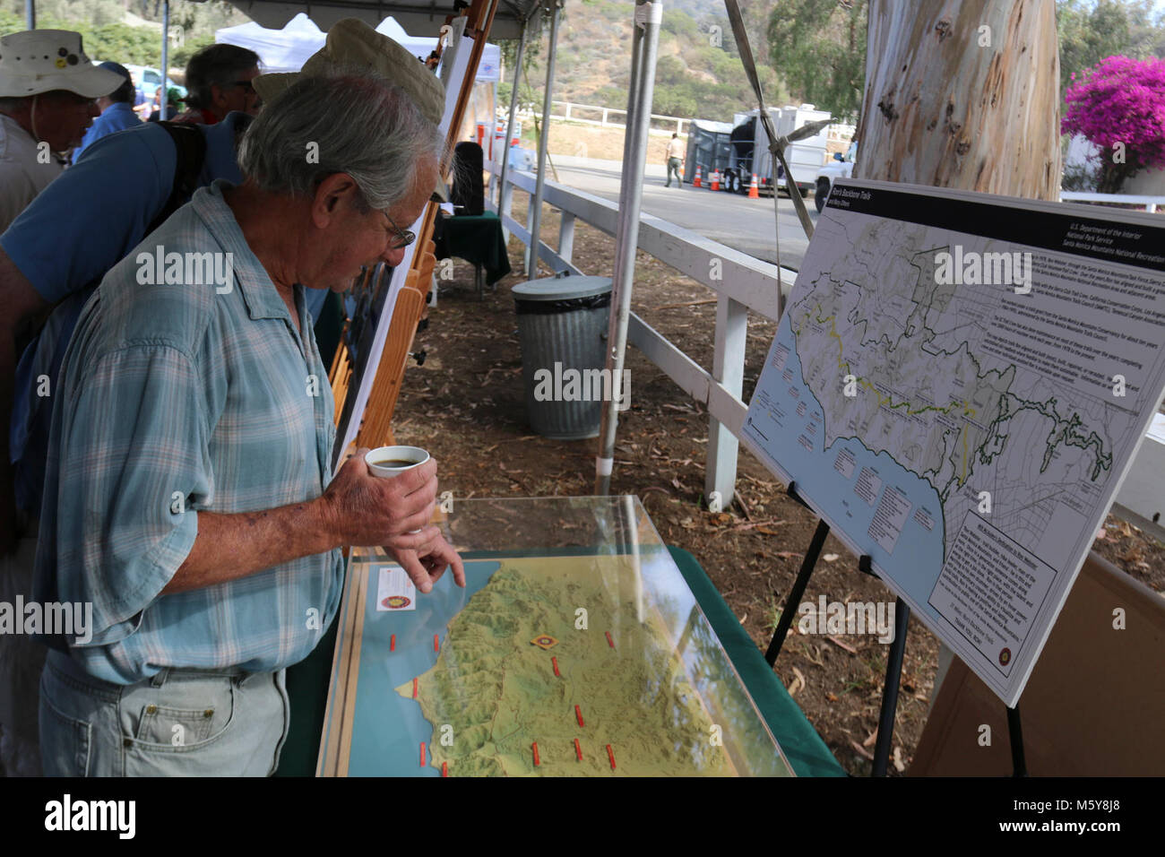 Backbone Trail Maps. Guests at the Backbone Trail ceremony review maps ...