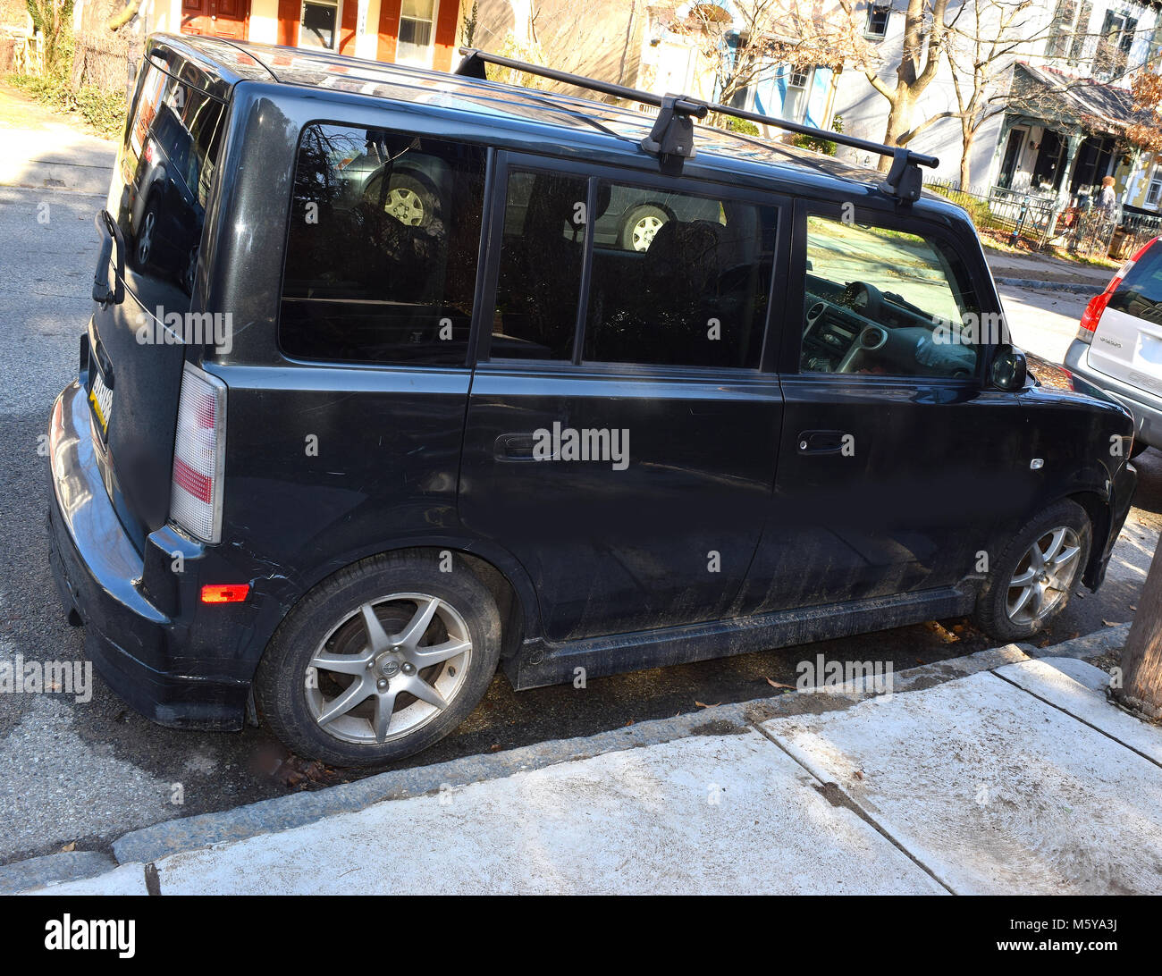 Large black car parked on the street Stock Photo - Alamy