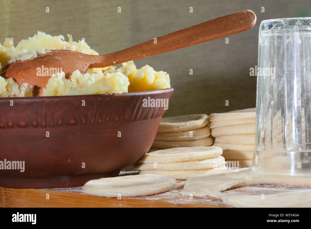 process of cooking Ukrainian vareniki: dough, boiled potatoes, flour ...