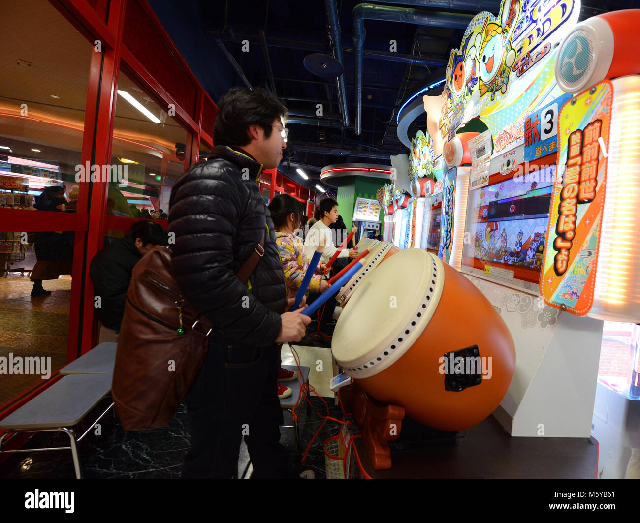 A busy gaming center in the Canal city shopping mall in Fukuoka Stock ...