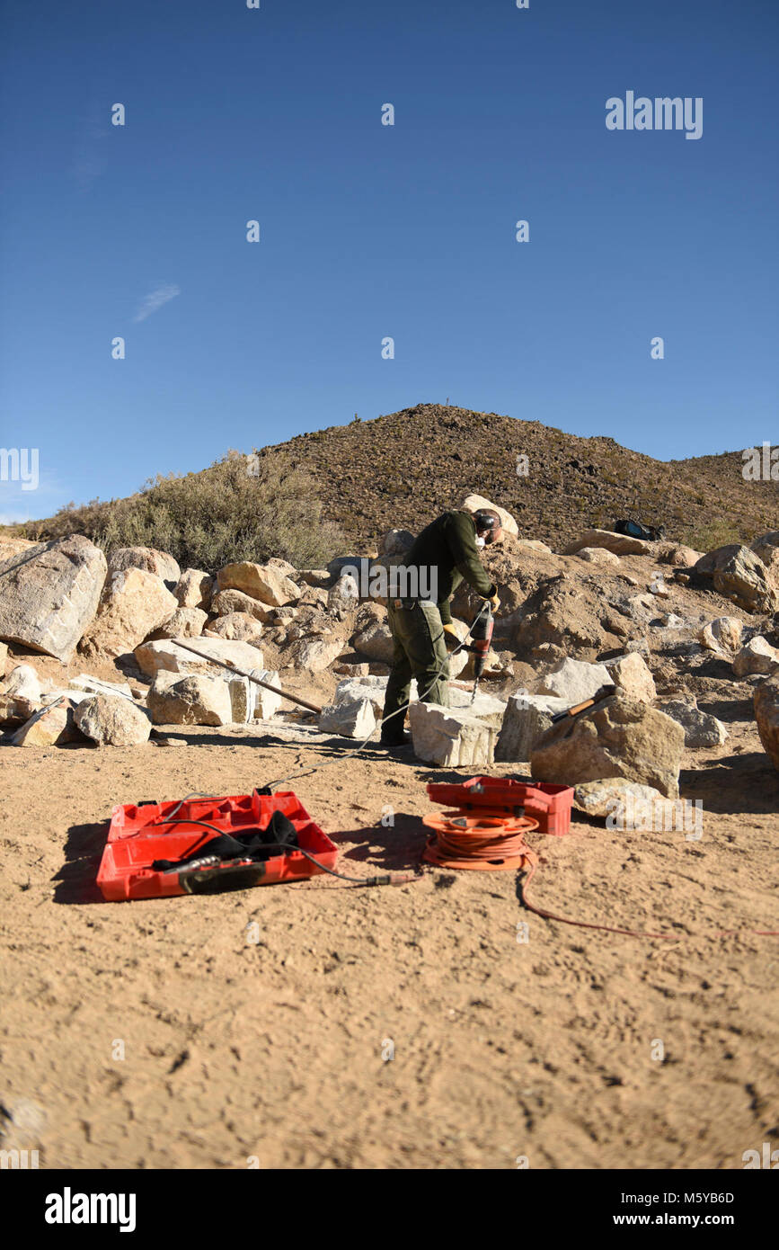 Rock Work. Trail crew works on rocks that will be used on trail ...