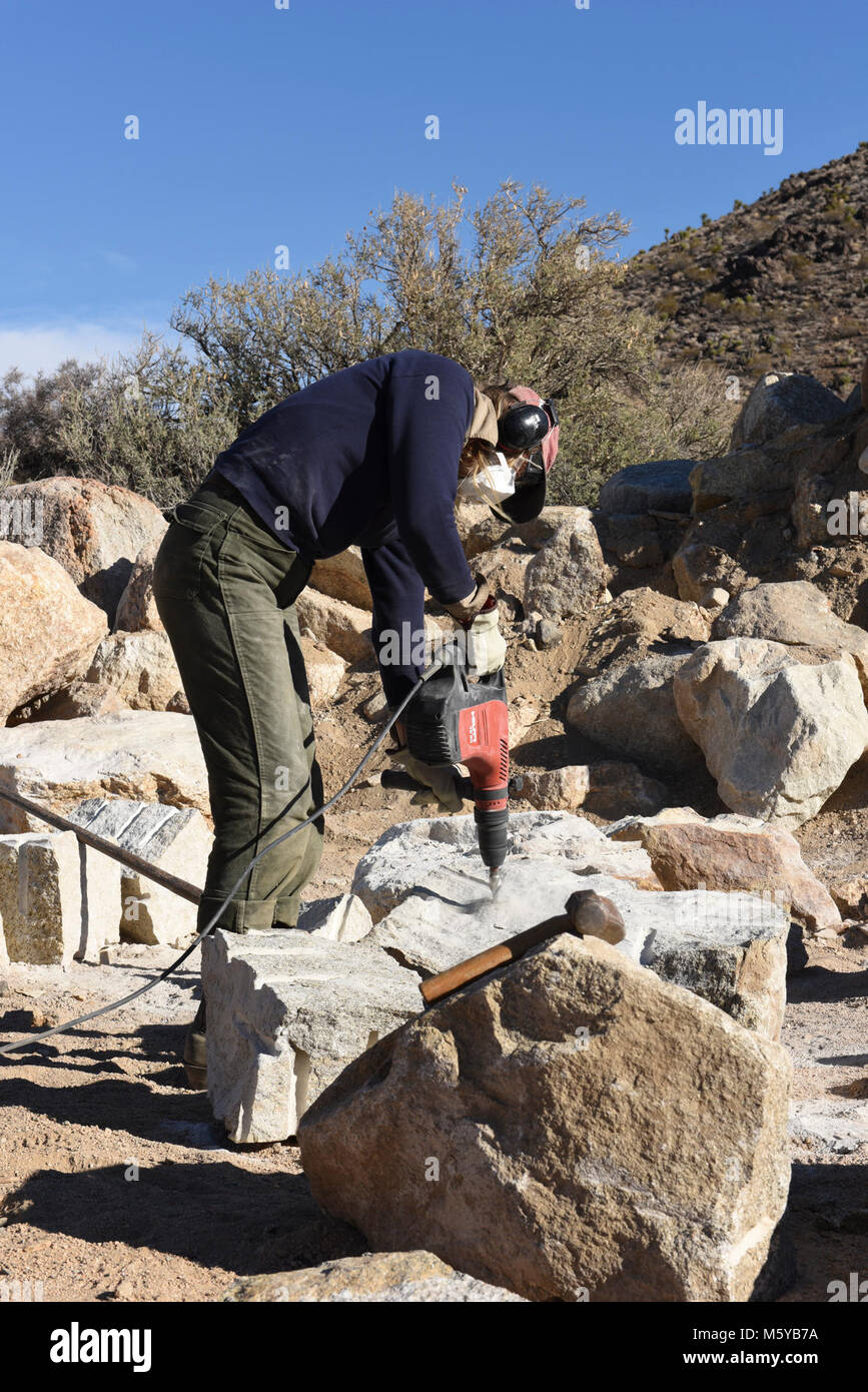 Rock Work. Trail crew works on rocks that will be used on trail ...