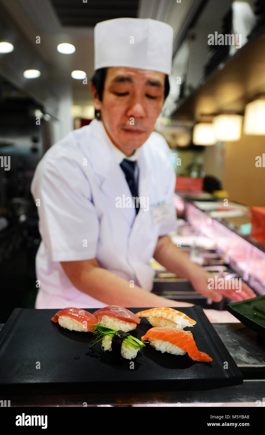 An Itamae - A Sush master-chef preparing a platter of Sushi in a Sush ...