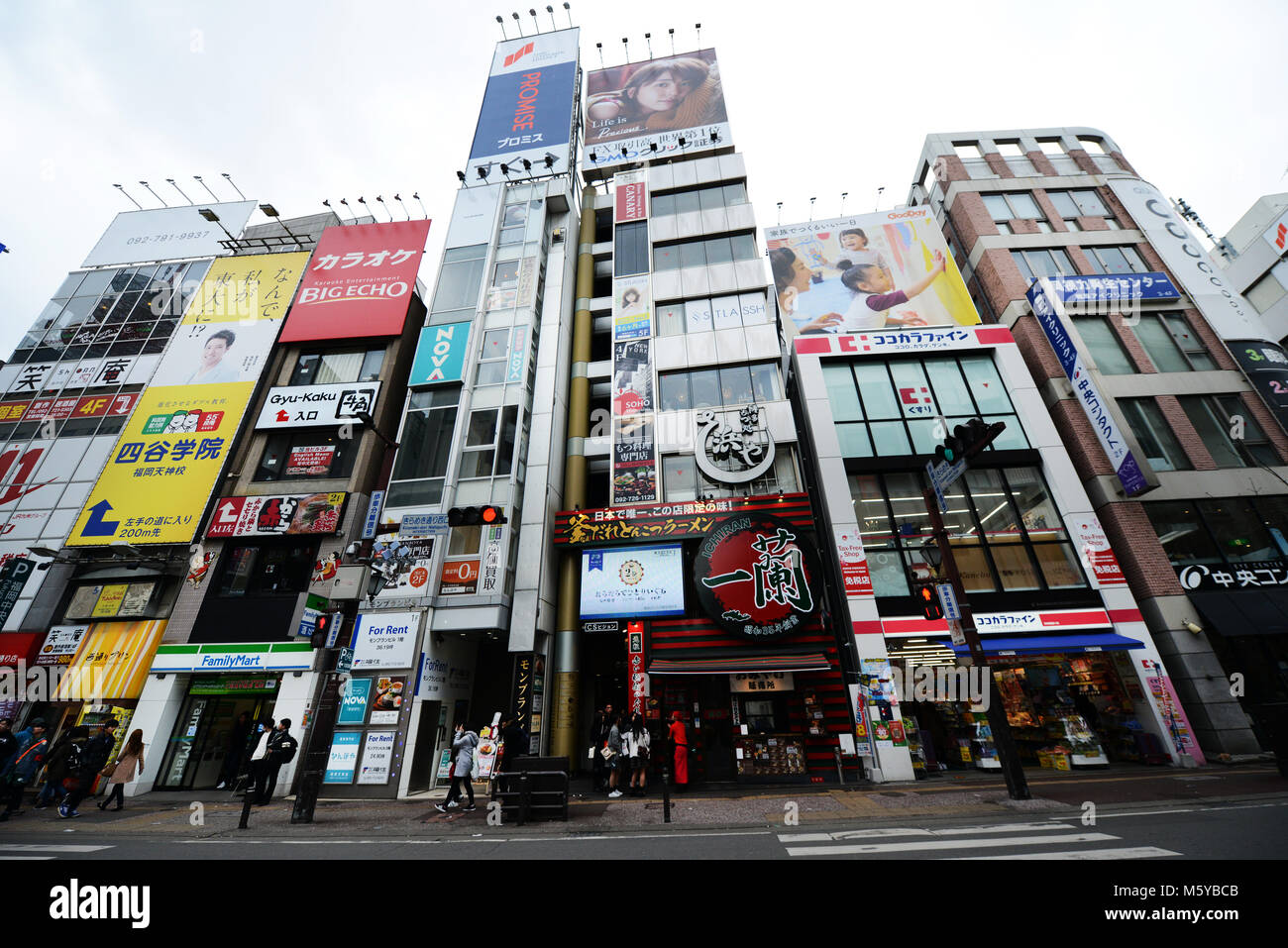 The busy shopping district near the Fukuoka ( Tenjin ) railway station ...