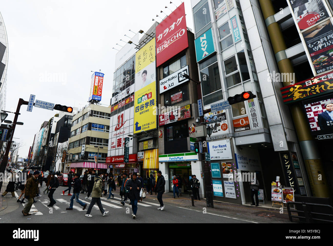 The busy shopping district near the Fukuoka ( Tenjin ) railway station ...