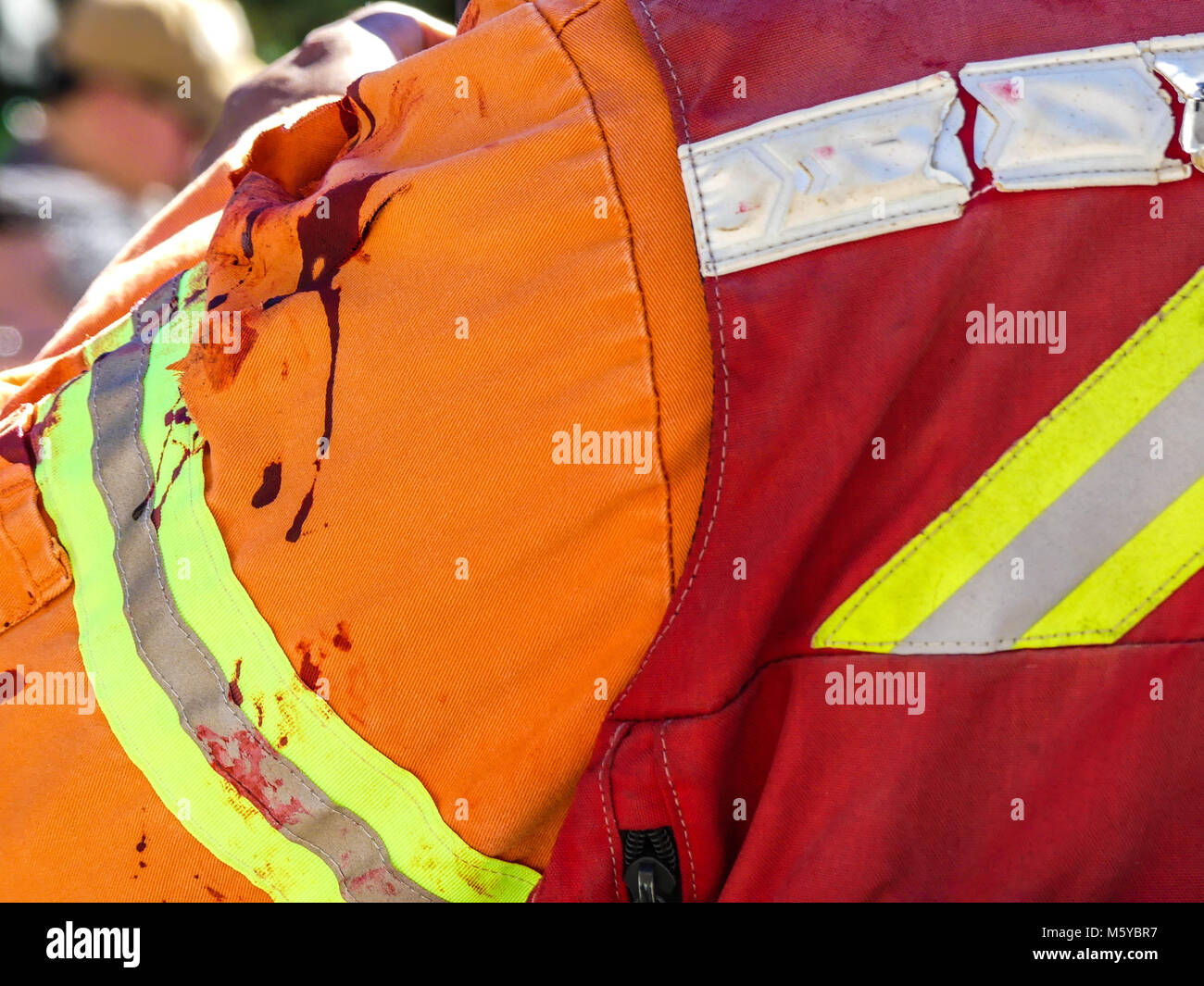 Injured fireman bloodstaines sleeve uniform Stock Photo - Alamy