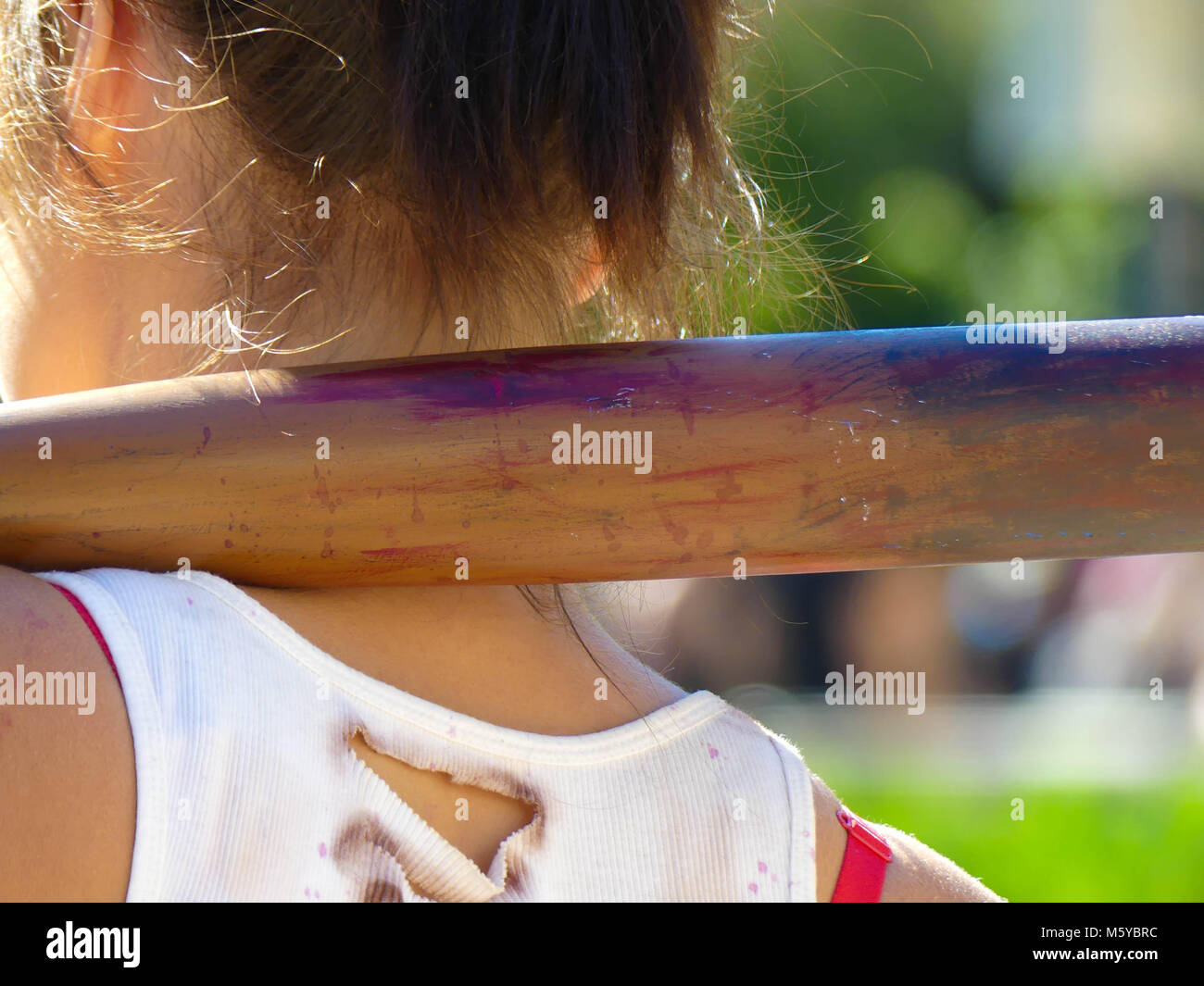 Concept violence youth girl holding baseball bat Stock Photo - Alamy