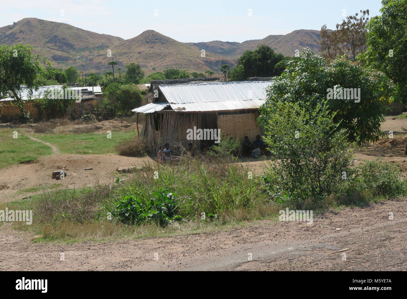 Poverty in Malagasy village. Small simple home on countryside of ...