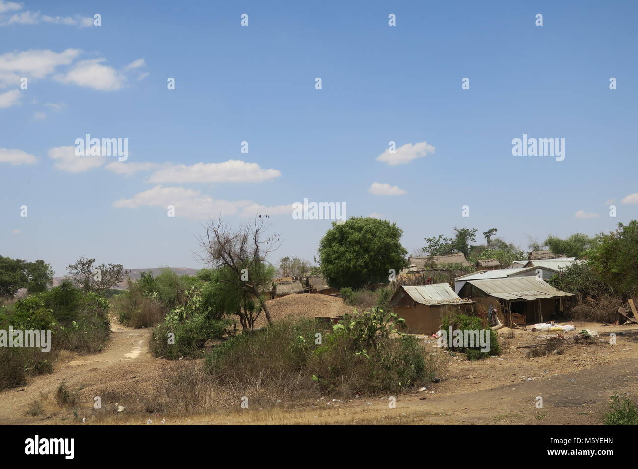 Poverty in Malagasy village. Small simple home on countryside of ...