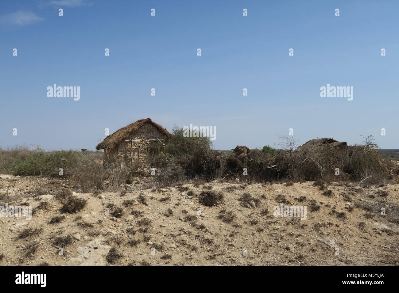Poverty in Malagasy village. Small simple home on countryside of ...